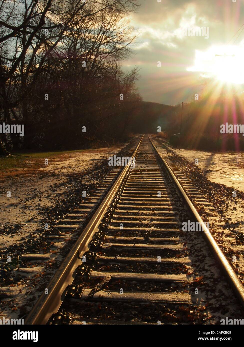 Train track sunset Stock Photo - Alamy