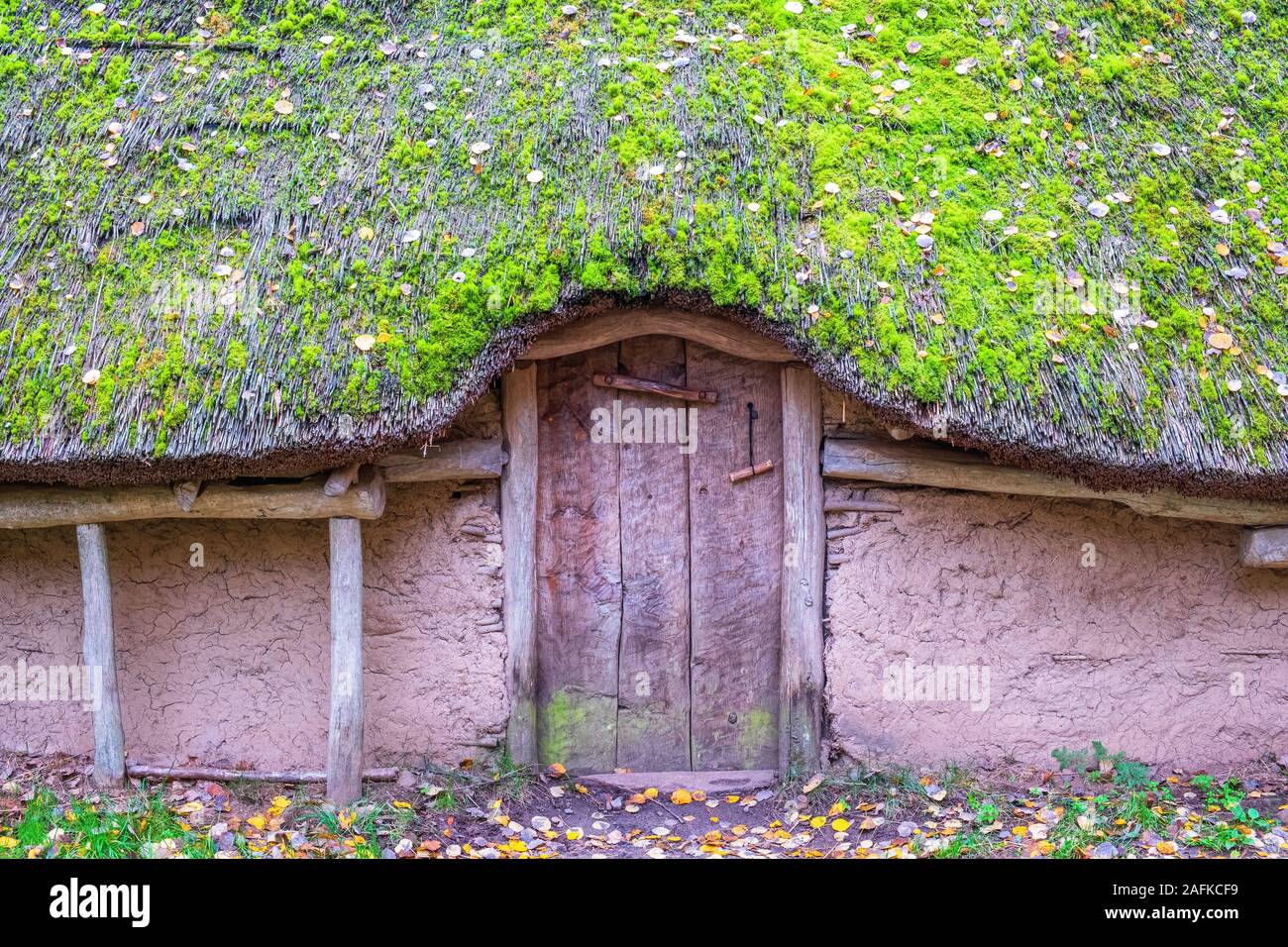 Longhouse build in clay and logs with a thatched roof Stock Photo - Alamy