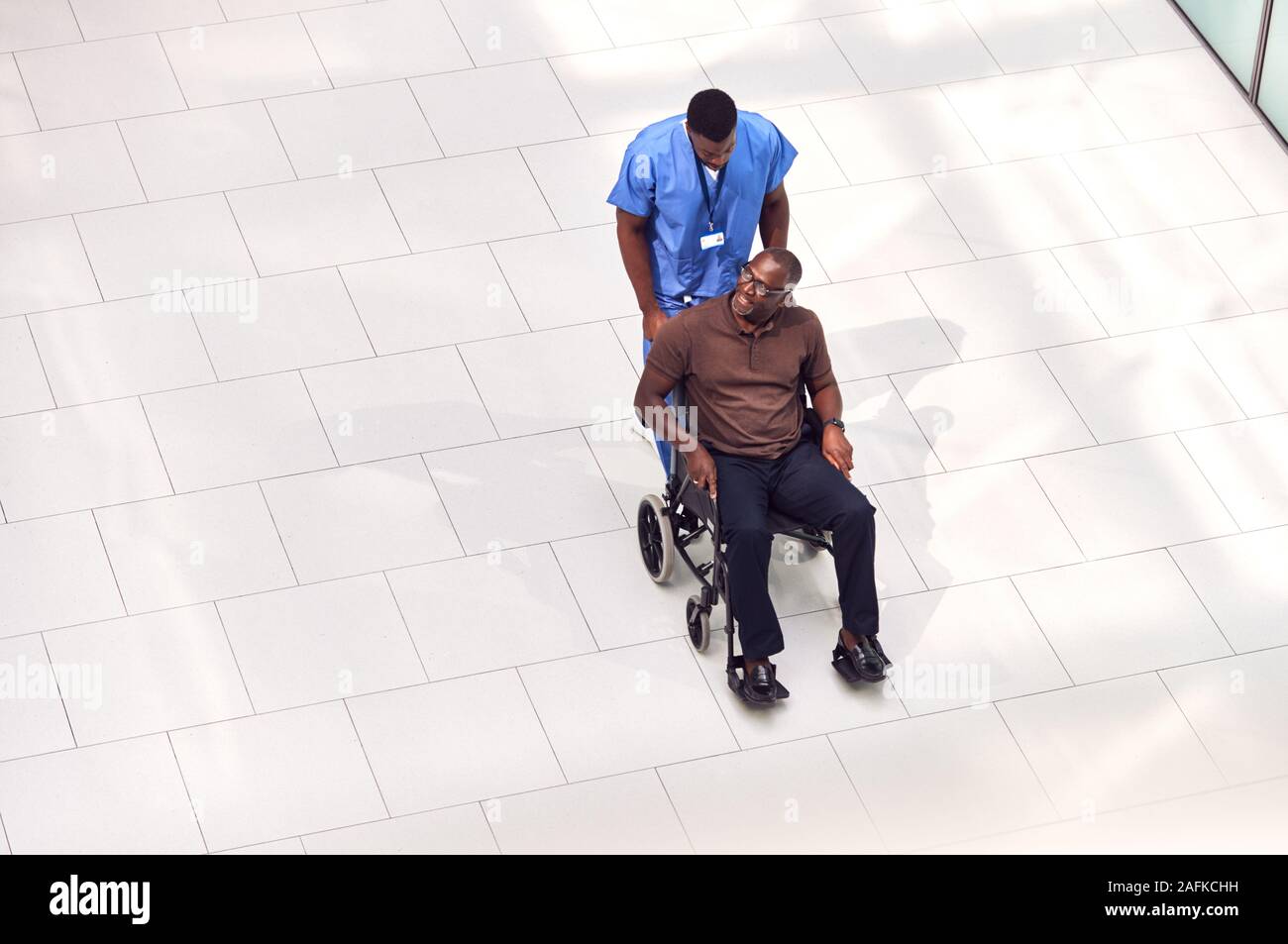 Wheeling in wheelchair hi-res stock photography and images - Alamy