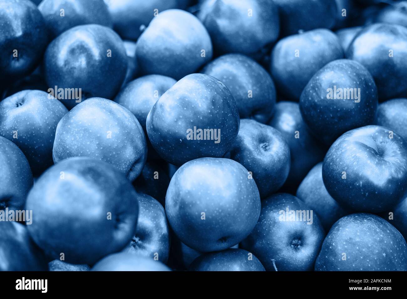 Closeup apples background in trendy classic blue color Stock Photo - Alamy