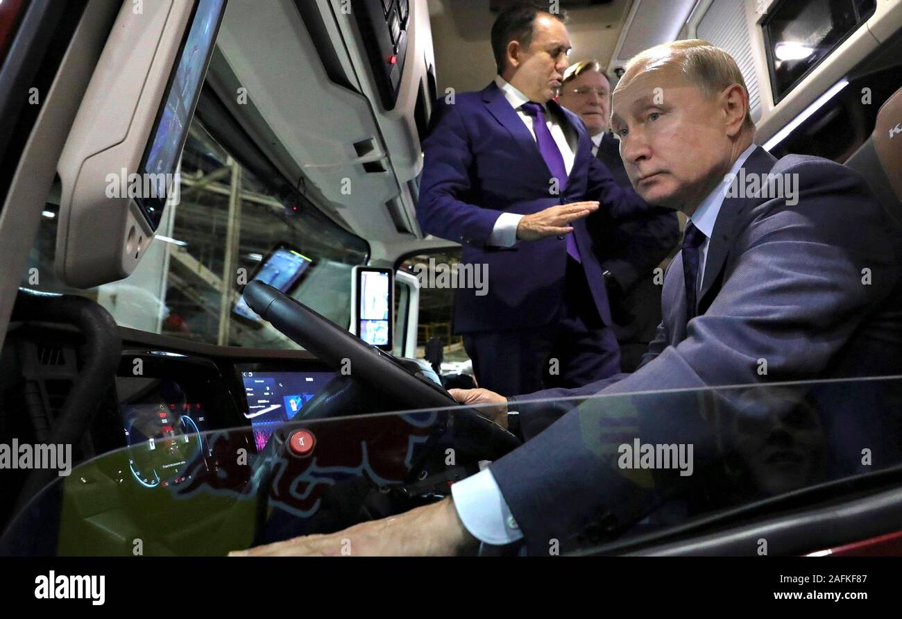 Russian President Vladimir Putin sits in the drivers seat of a KAMAZ ...