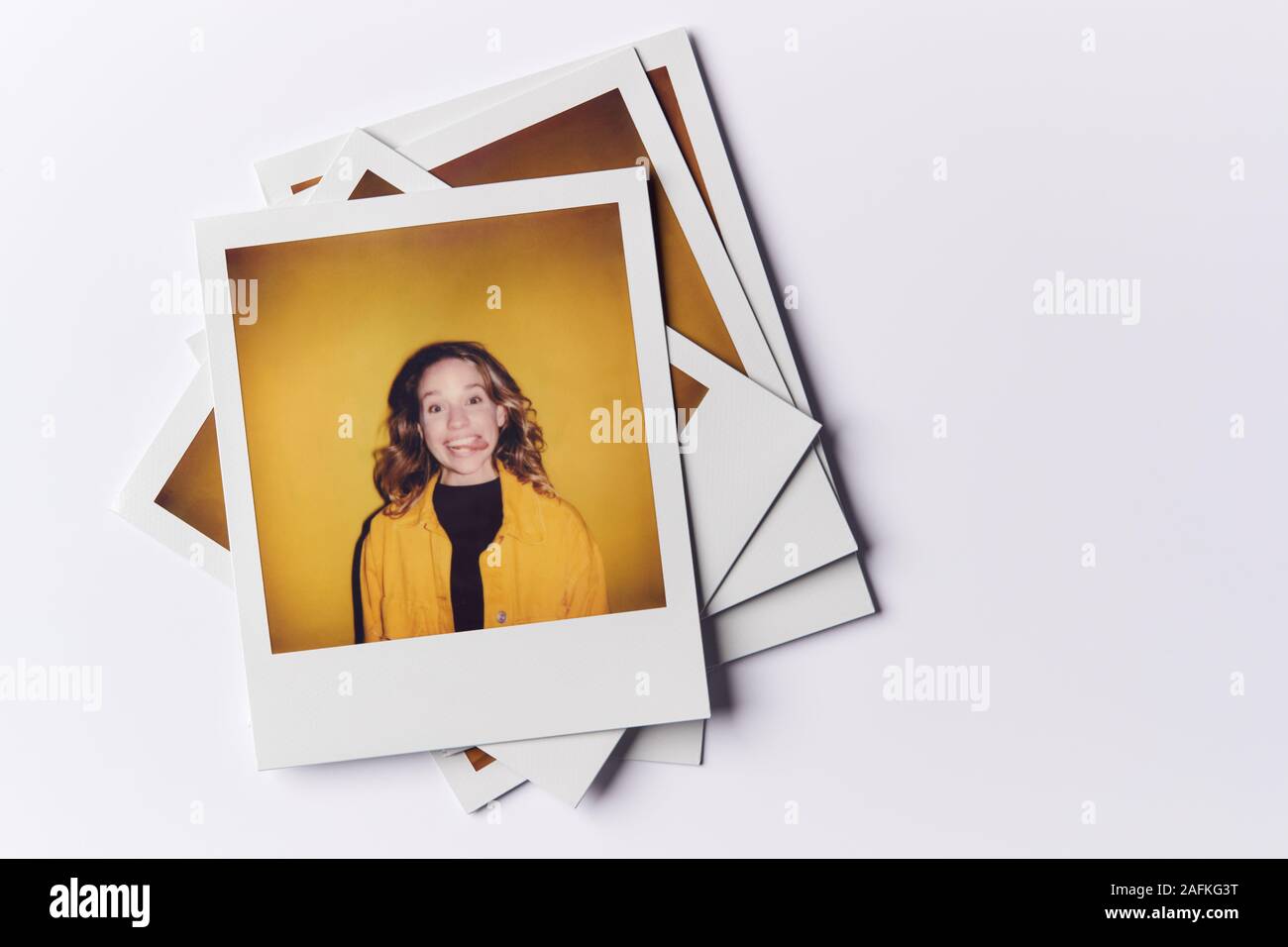 Stack of instant photos of young woman hi-res stock photography and ...