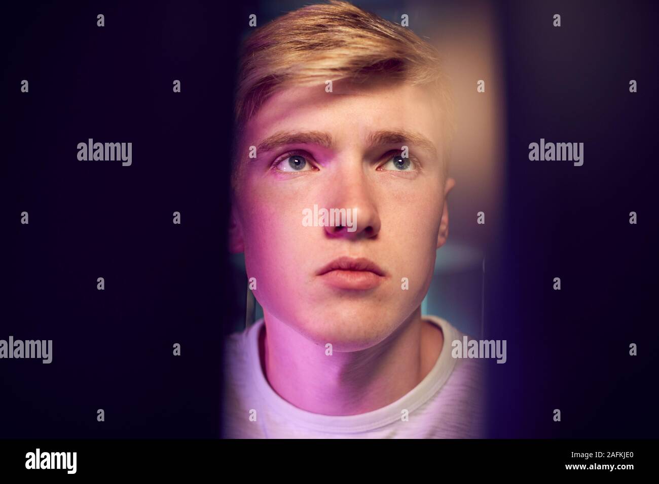 Male Teenage Hacker Sitting Between Computer Screens Bypassing Cyber ...