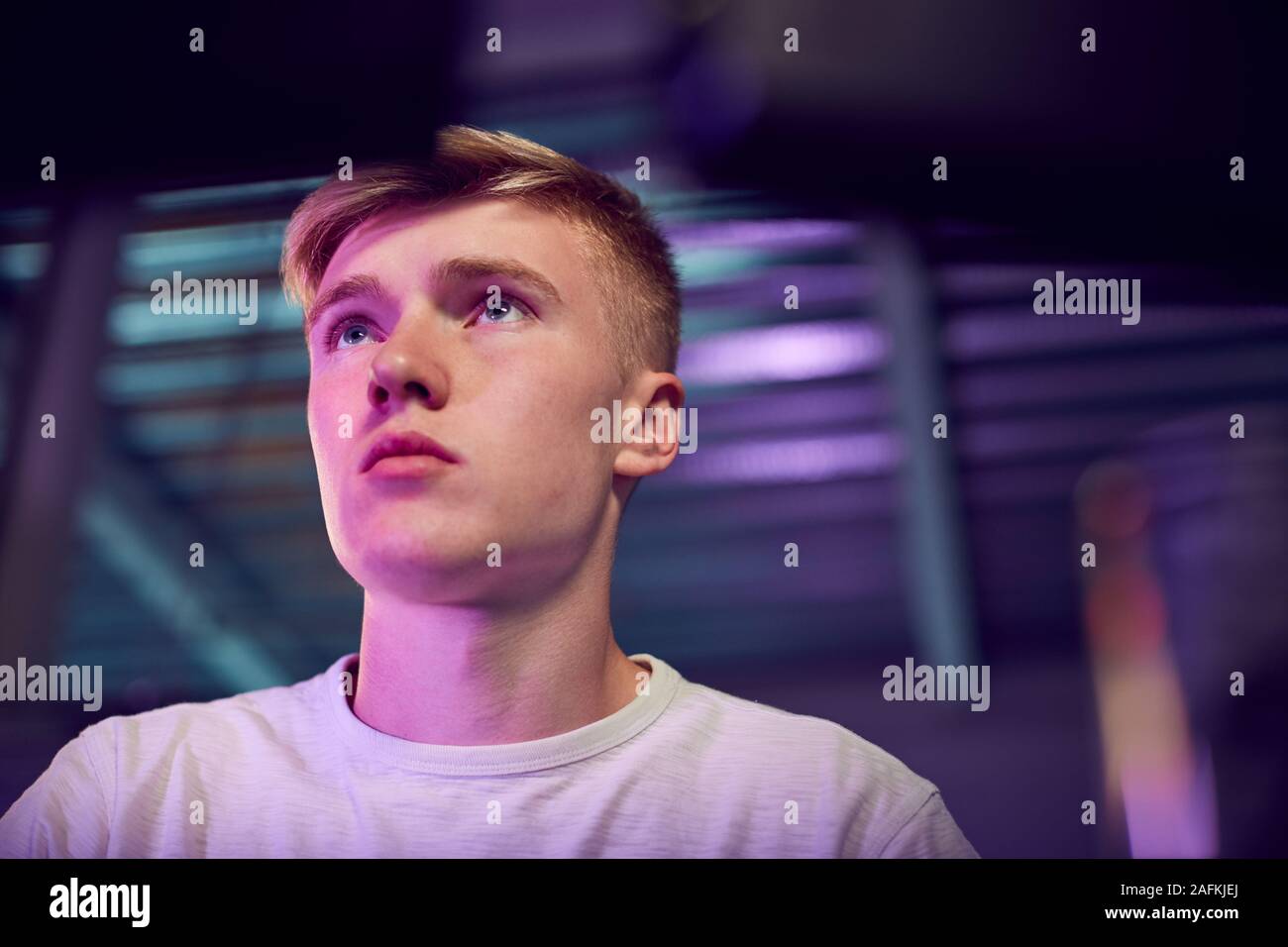 Male Teenage Hacker Sitting Between Computer Screens Bypassing Cyber ...