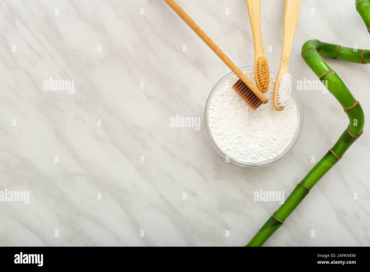 Bamboo toothbrush, bamboo plant dentifrice tooth powder on white marble ...