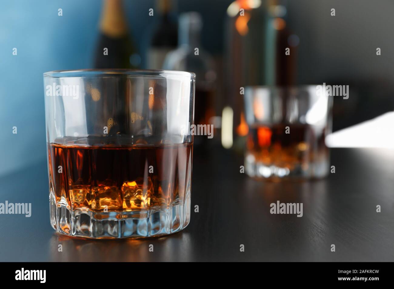 Glasses of whiskey on bar counter, close up and space for text Stock ...