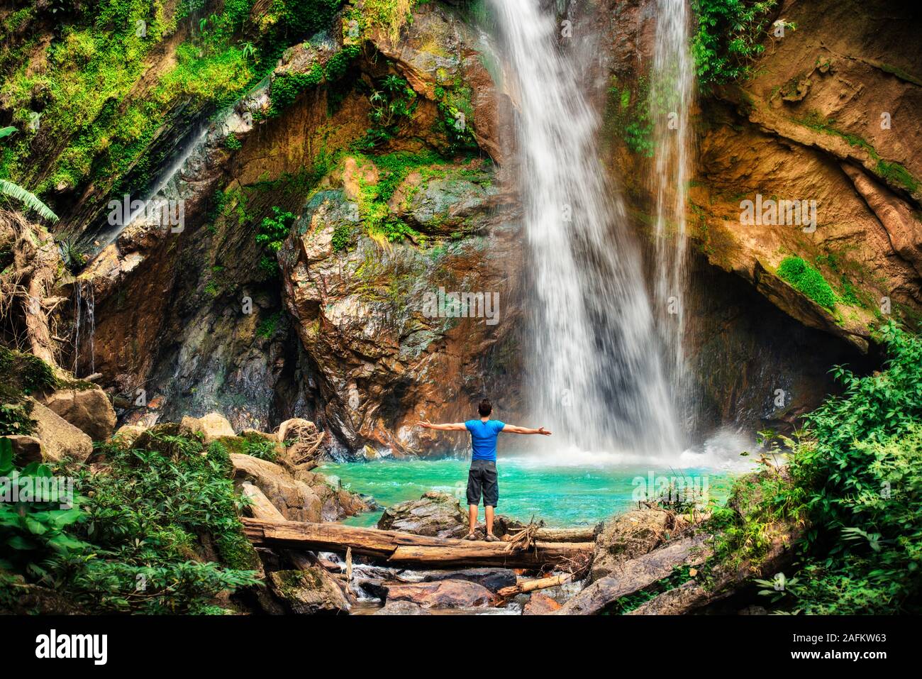 man next to waterfall Stock Photo - Alamy