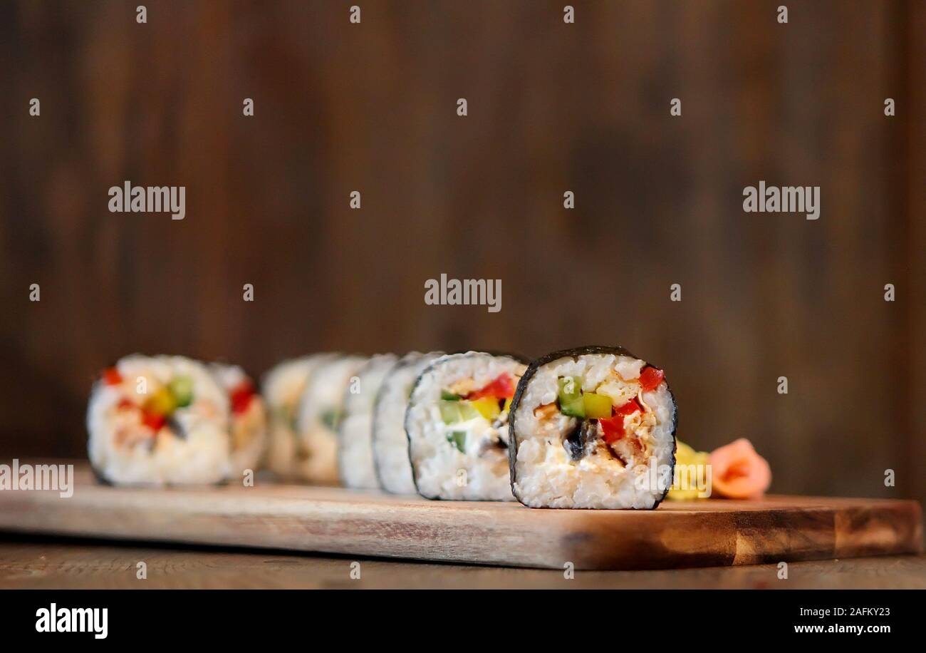 hot roll set sashimi japanese food on wooden background with lemon and ...