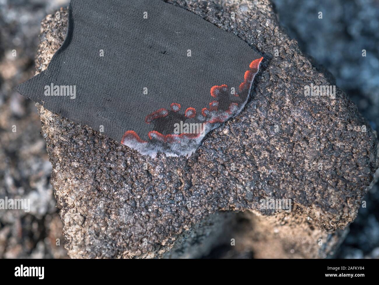 Survival skills. Close shot of burning charcloth. Material is used in ...