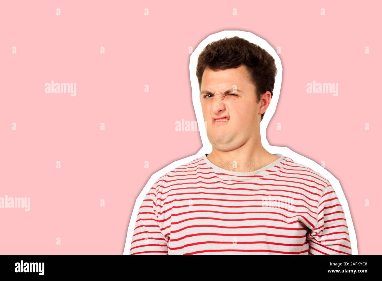 Disguting Shocked young man looking at something unpleasant and bad ...