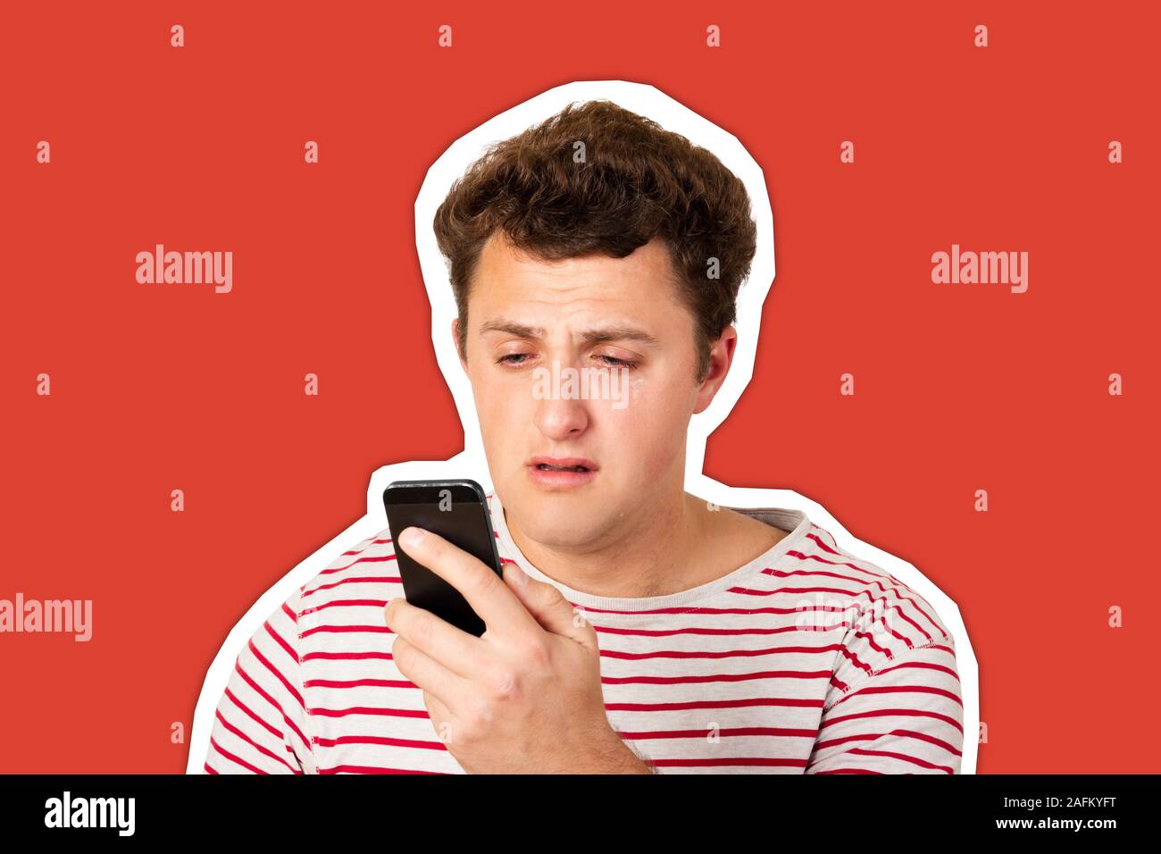 A crying man reads a text message on his phone. Sms with bad news ...