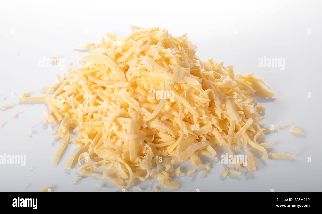 Grated cheese isolated on white background, close up Stock Photo - Alamy