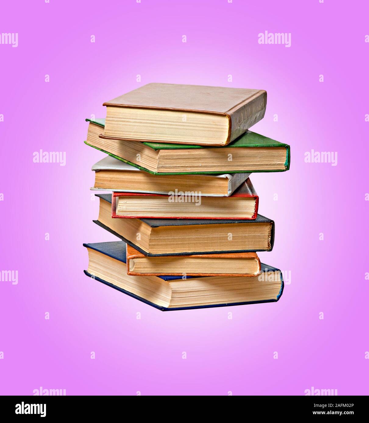 Pile of books on desk Stock Photo - Alamy