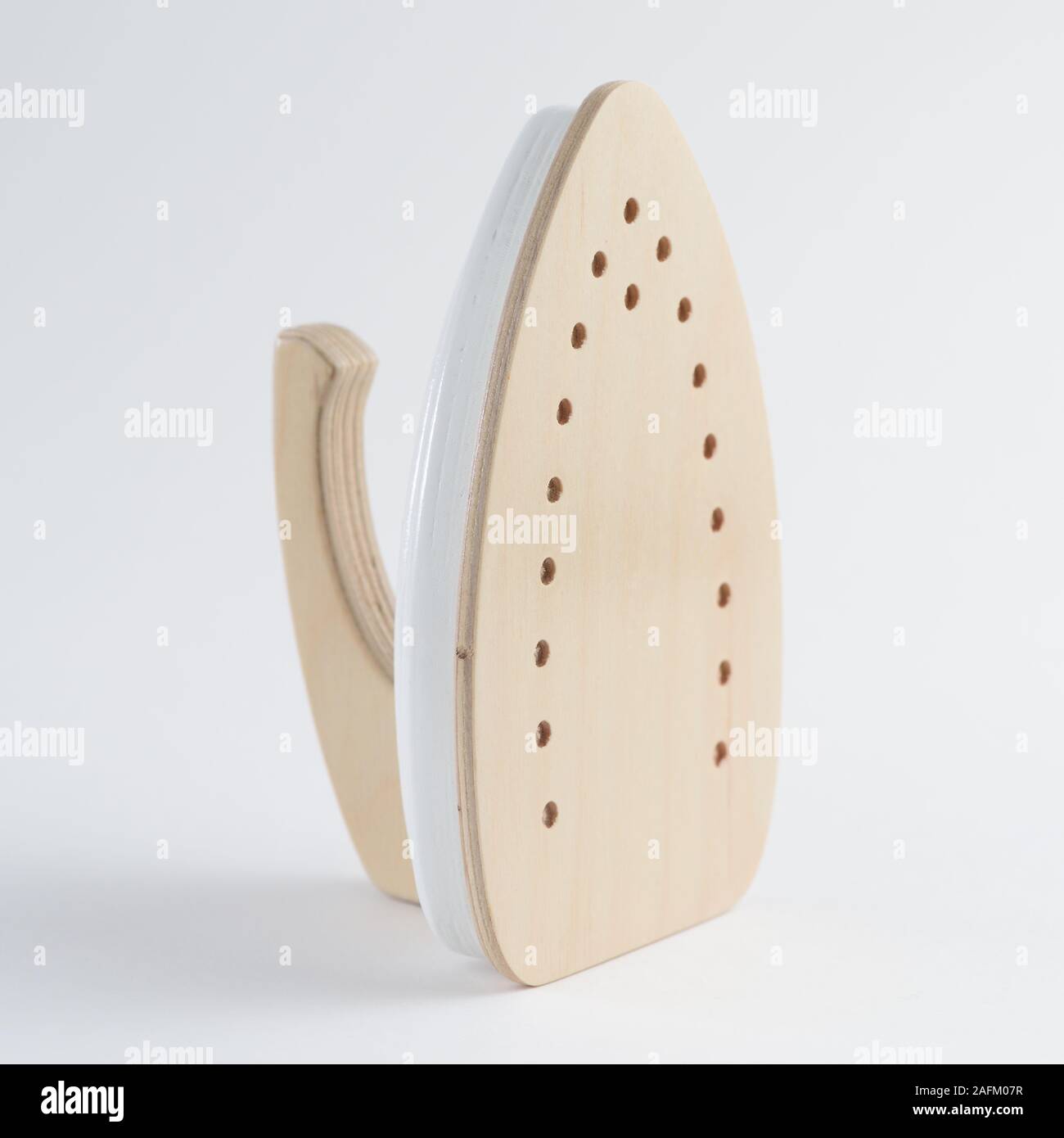 Play iron made of ply wood on white background copy space. Educational ...