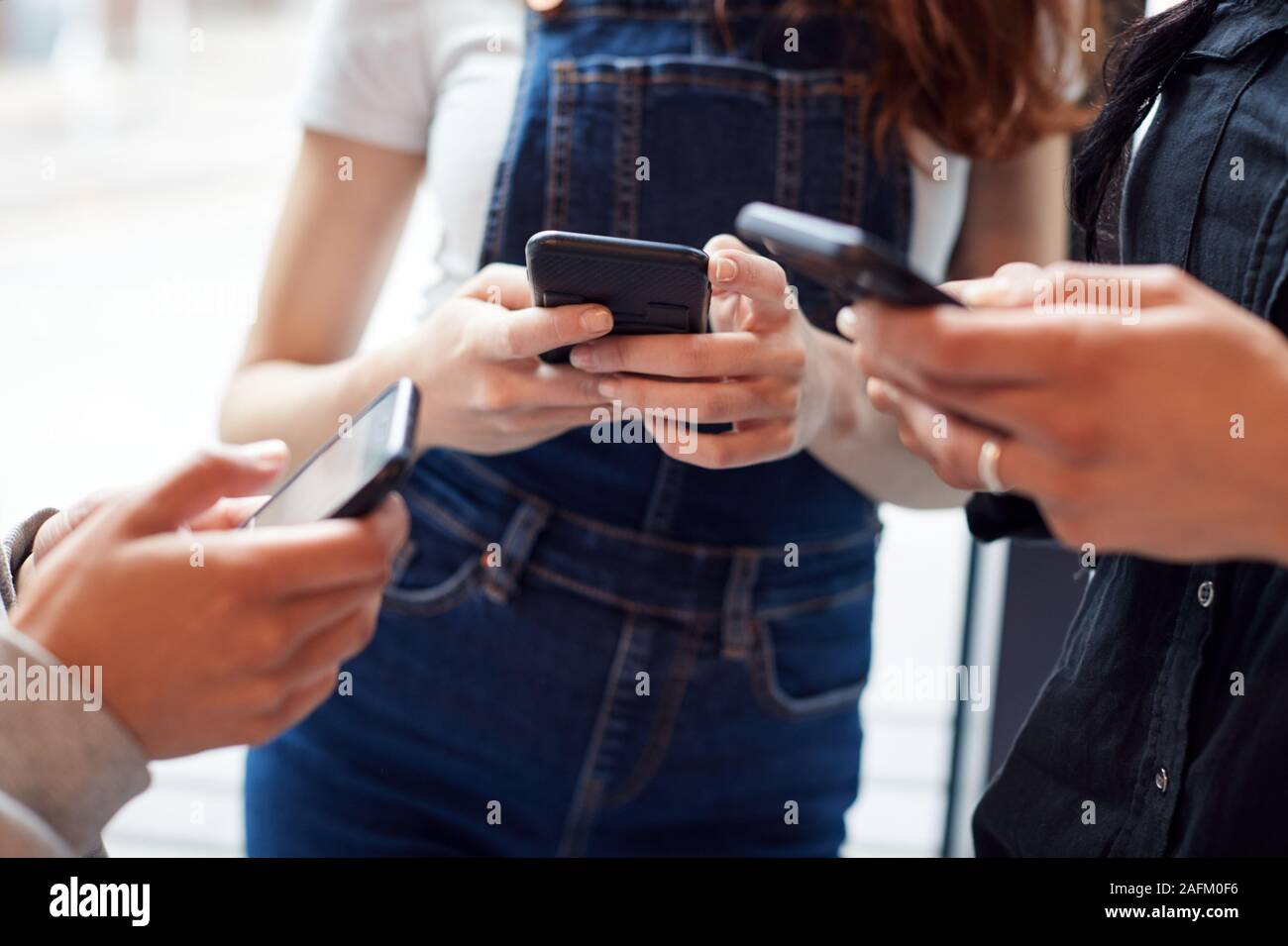 People in modern office mobile phones hi-res stock photography and ...