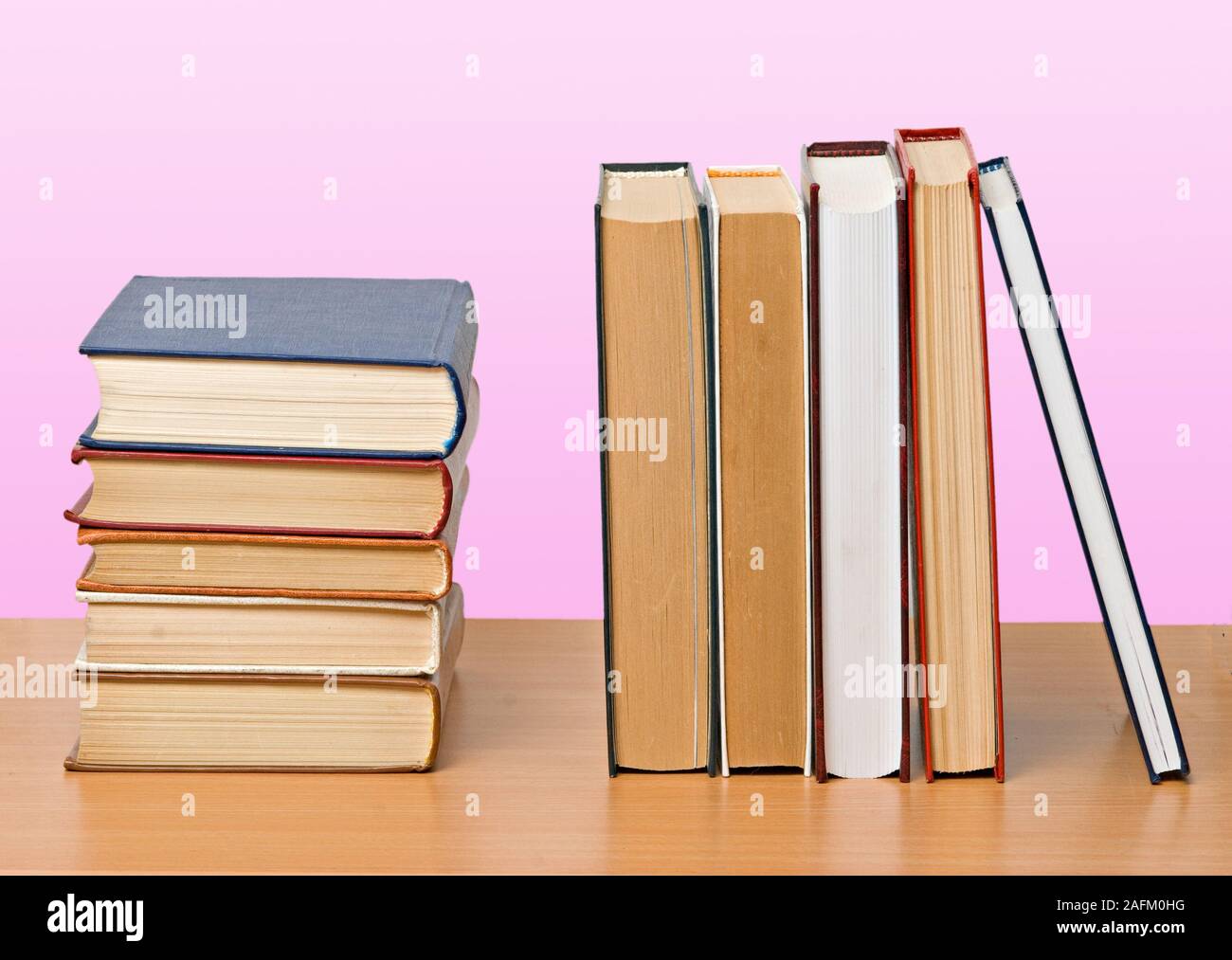 Books on desk Stock Photo - Alamy