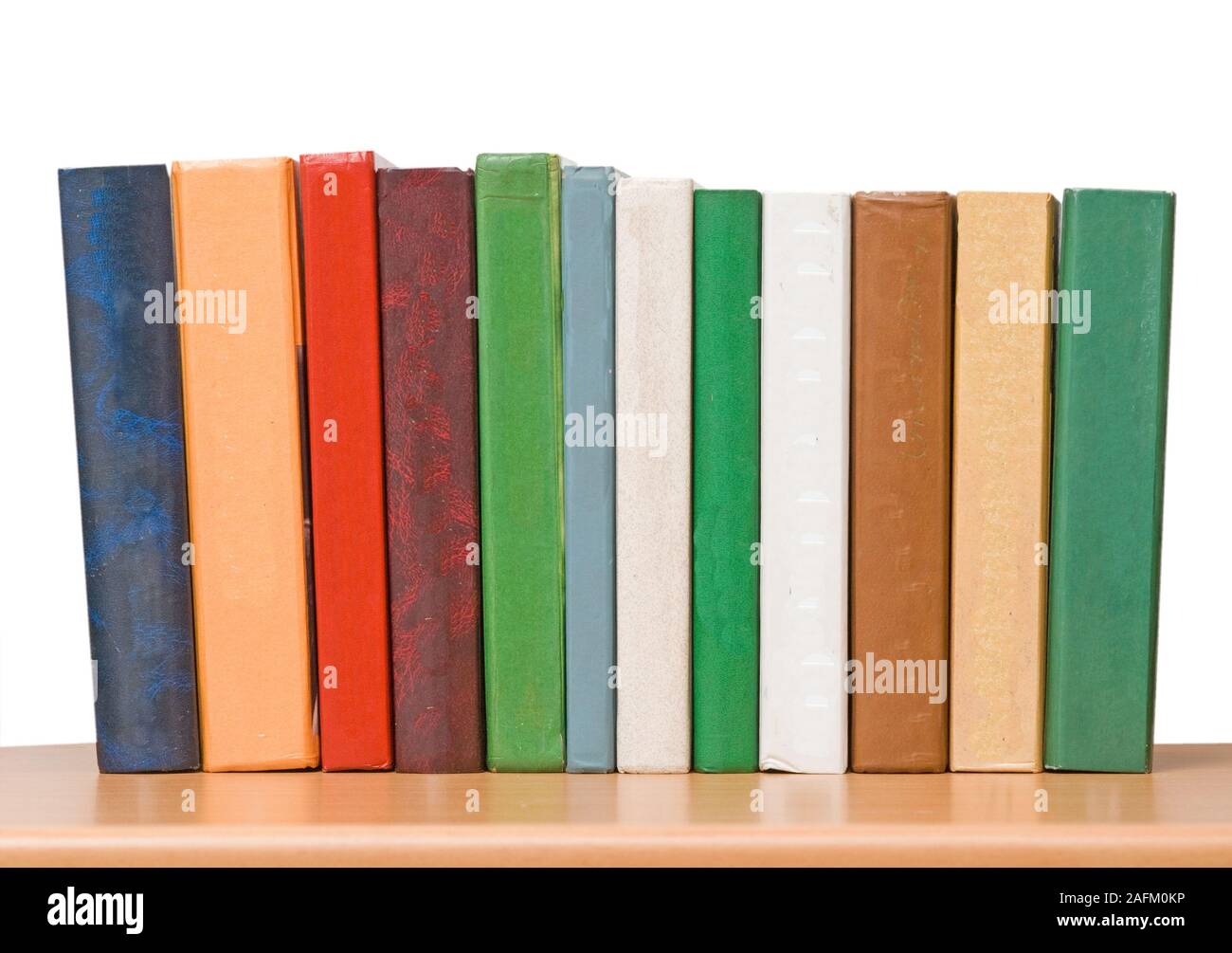 Row of books on shelf Stock Photo - Alamy
