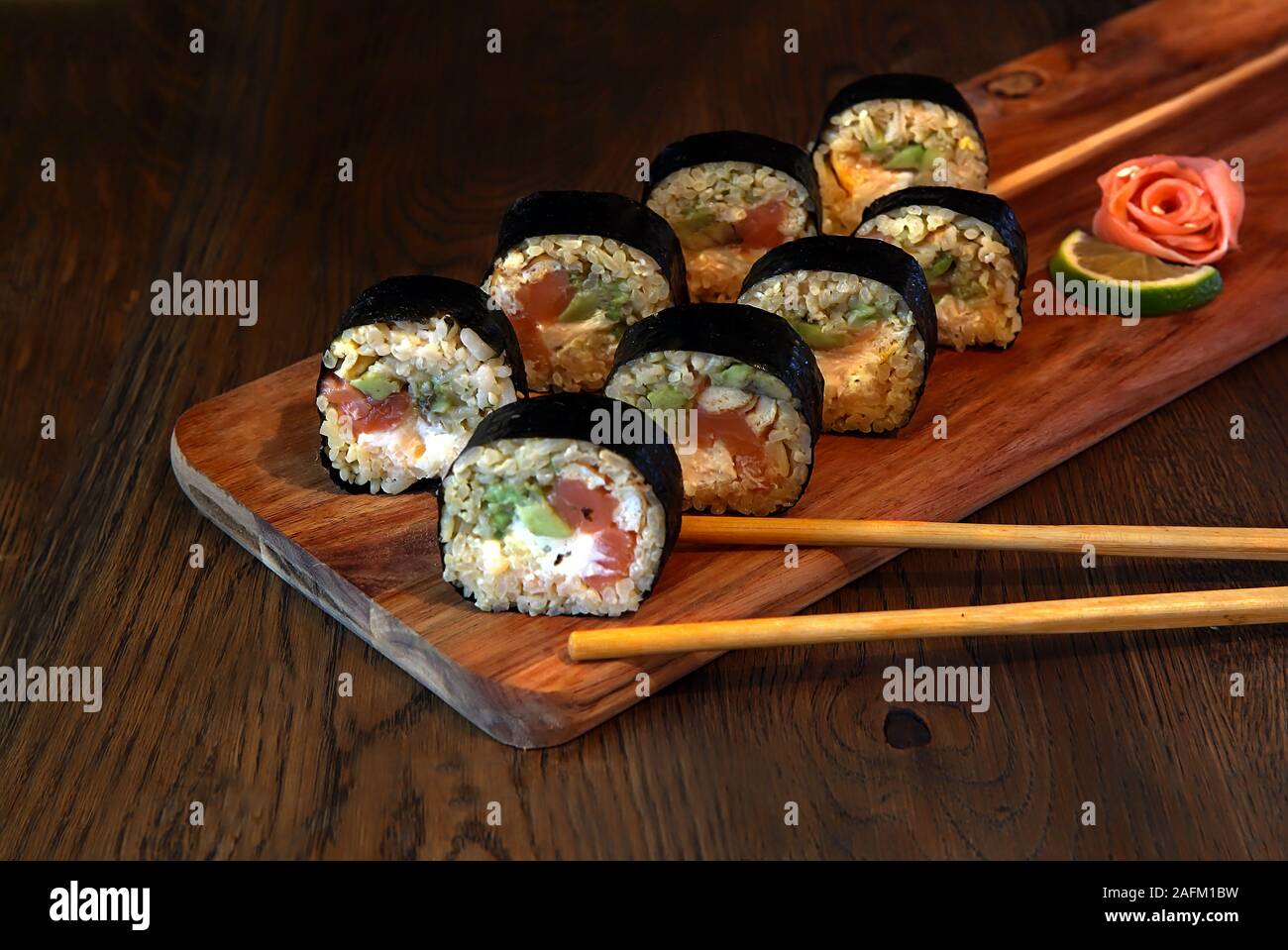 hot roll set sashimi japanese food on wooden background with lemon and ...