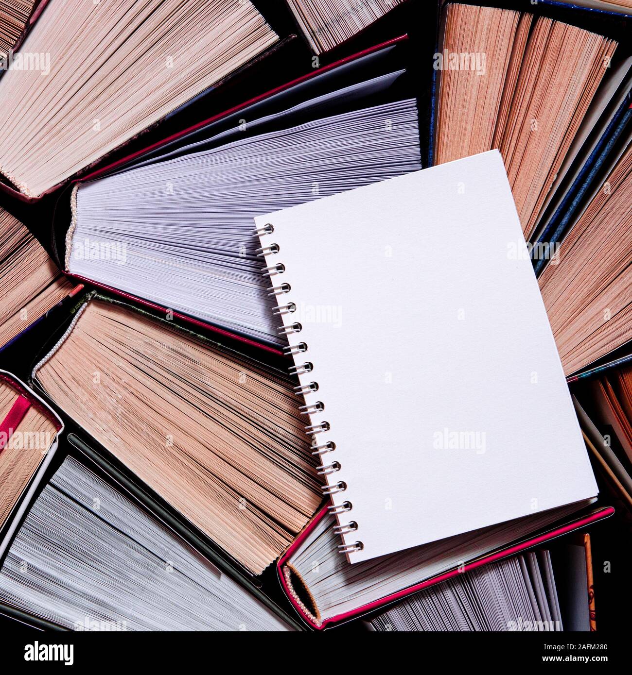 Library. Old open books stand on a bookshelf ready to read. Close-up ...