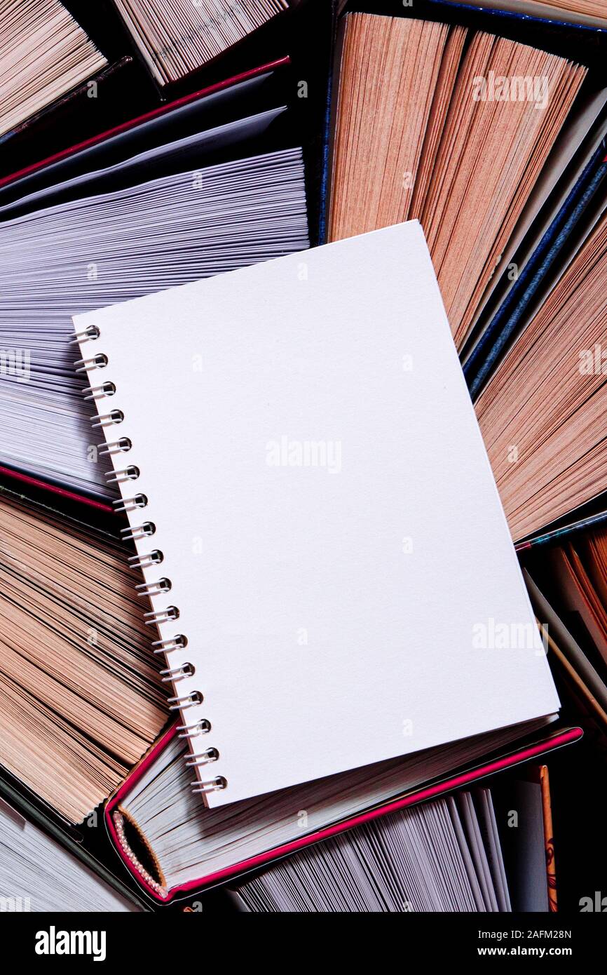 Library. Old open books stand on a bookshelf ready to read. Close-up ...