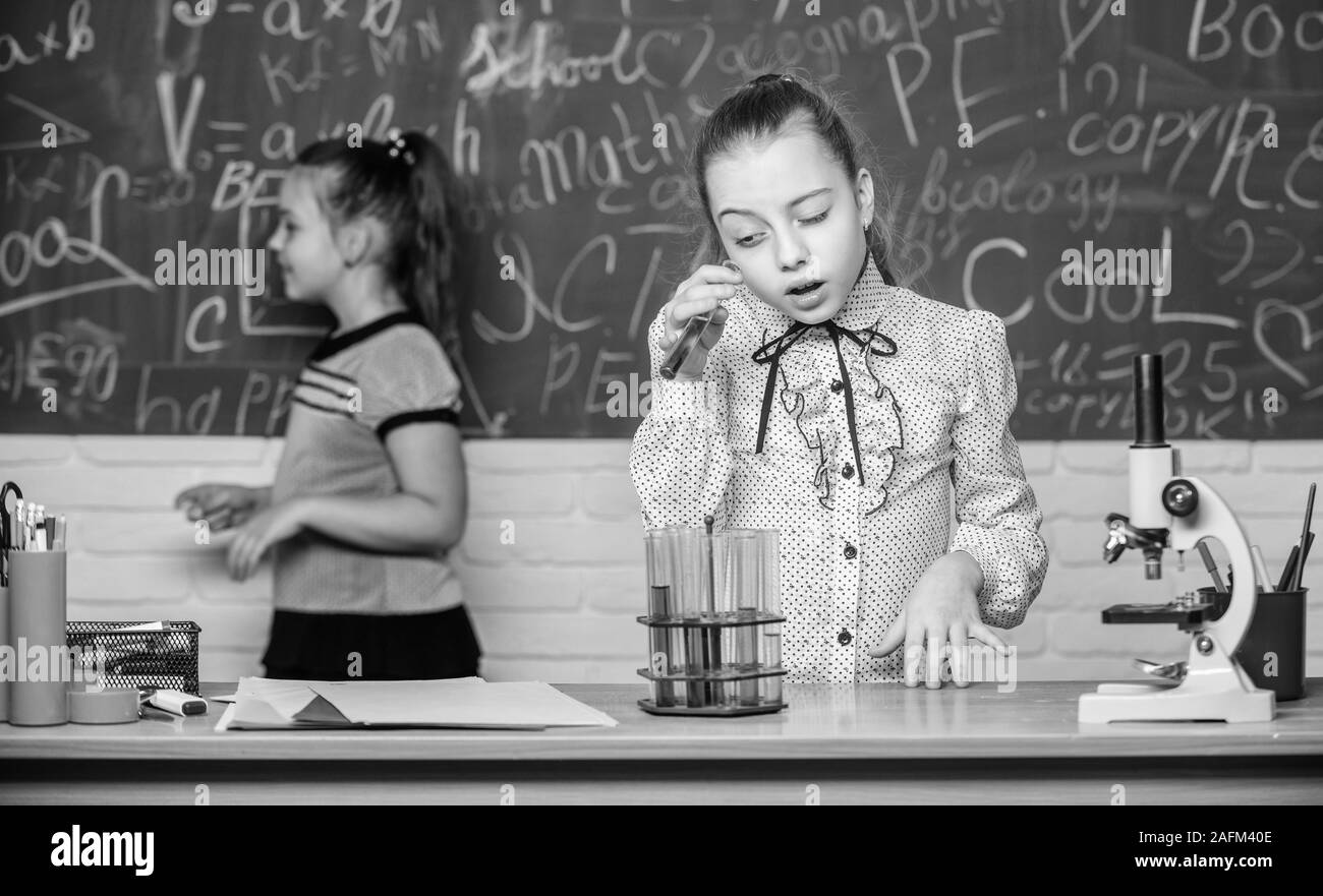 Biology lesson. Back to school. Little scientist work with microscope ...