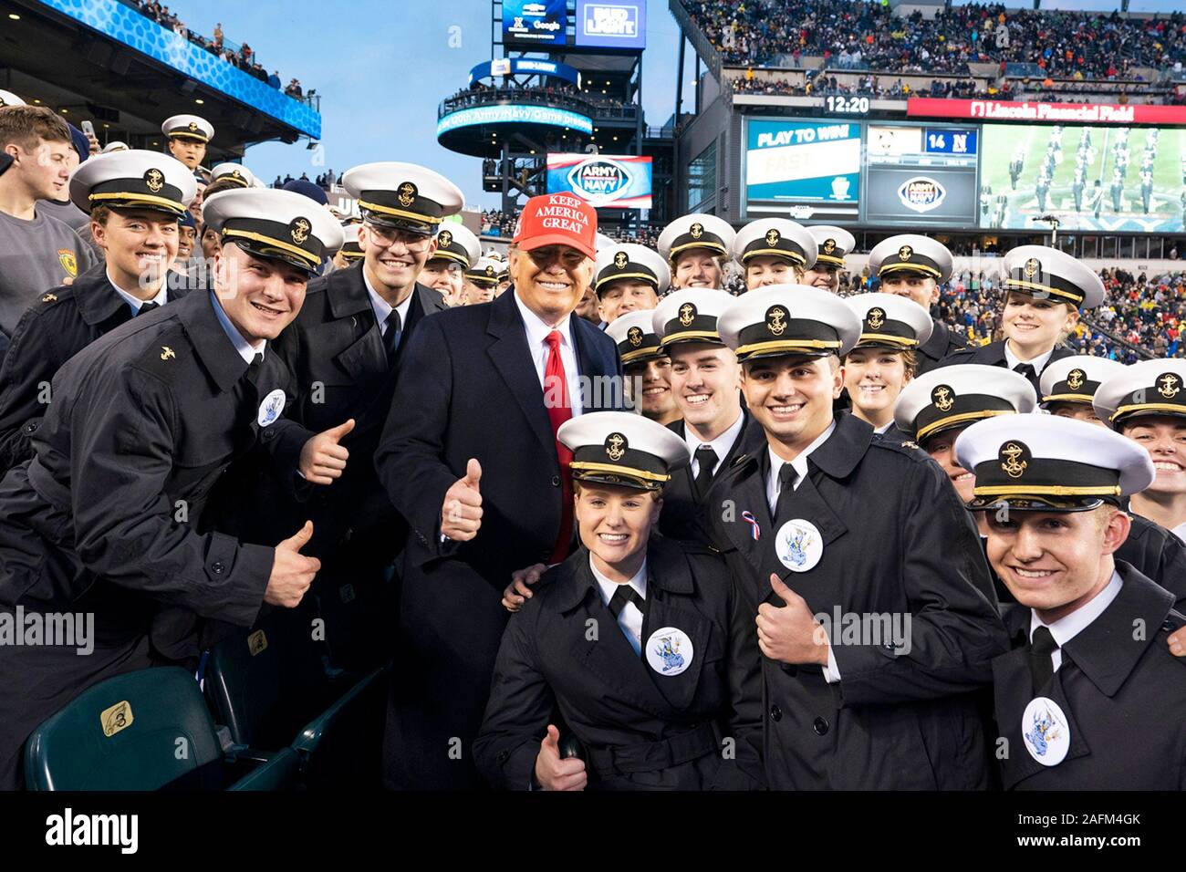 U.S. President Donald poses with U.S. Navy midshipmen at the start of ...