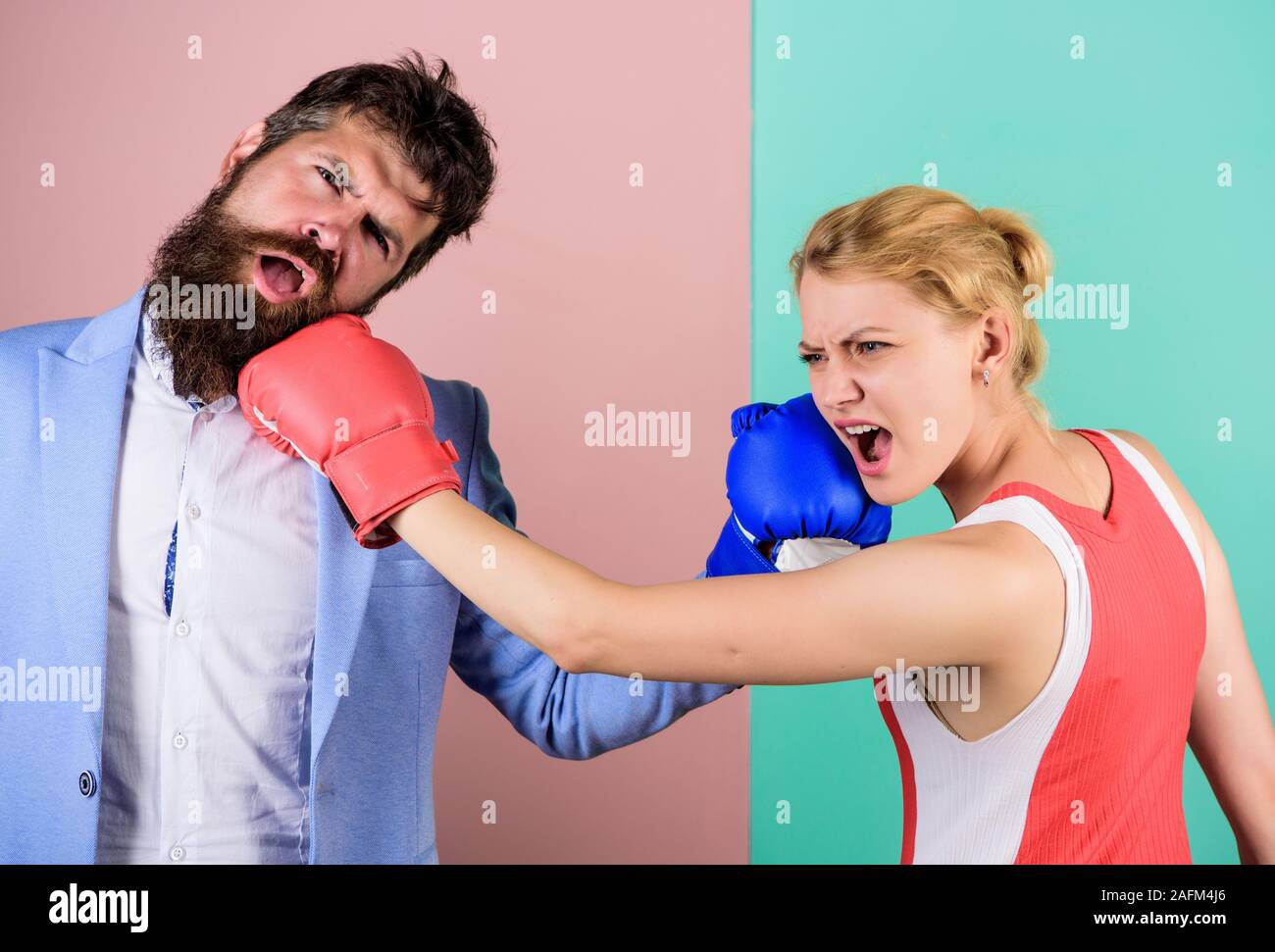 Couple in love competing in boxing. Conflict concept. Gender battle ...
