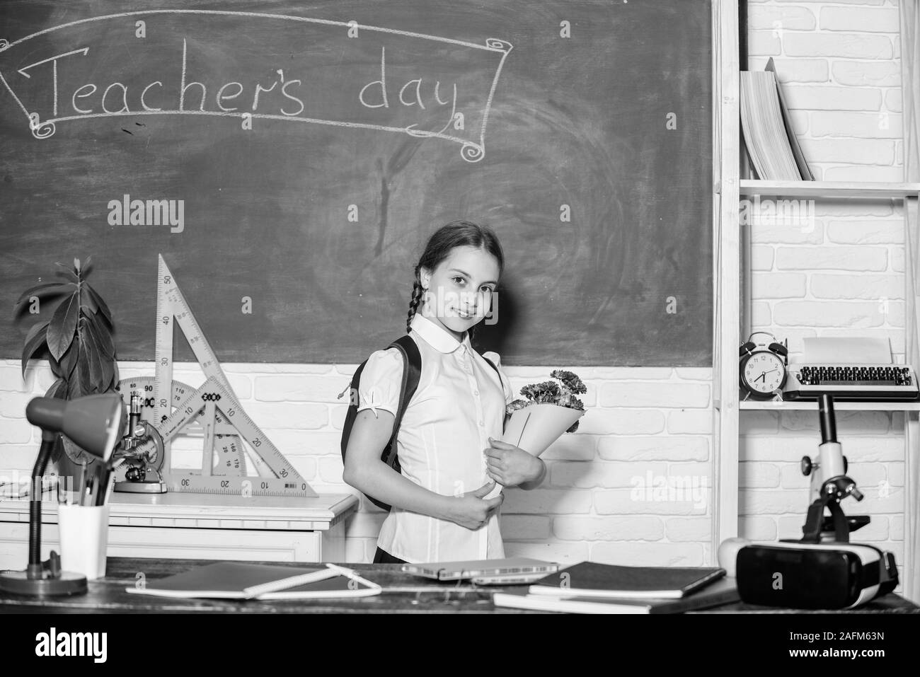 Knowledge day congratulations. Girl adorable pupil with backpack carry ...