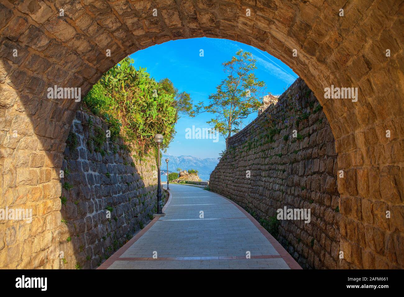 medieval pedestrian passing arch with pavement and bricks wall Stock ...