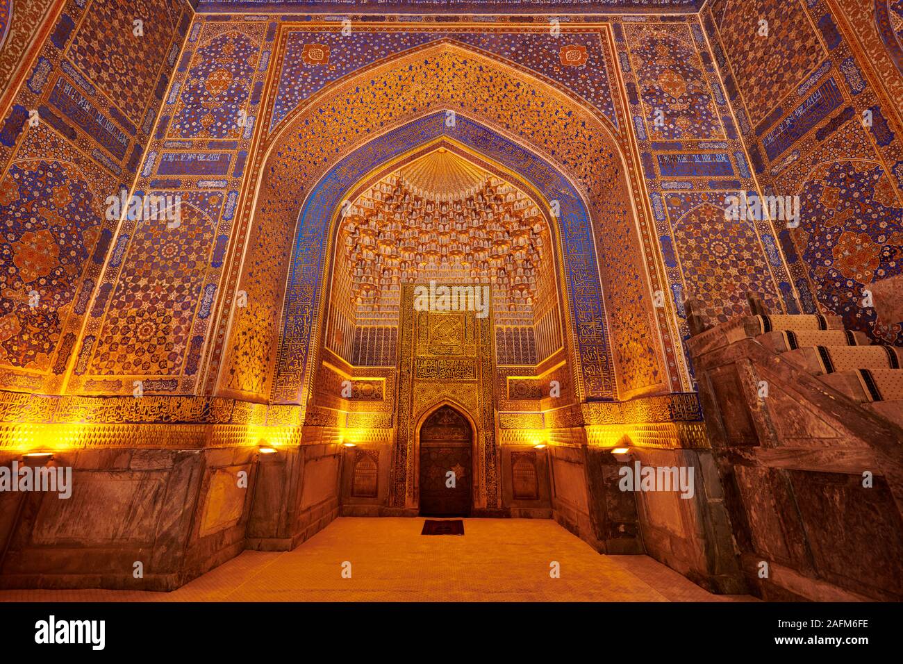 interior shot with golden decorated ceiling of Tilya-Kori-Madrasa or ...
