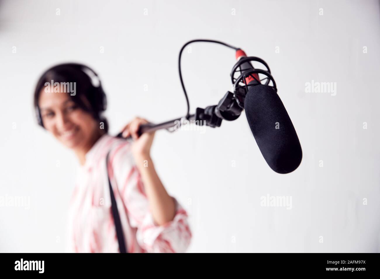 Portrait Of Female Sound Recordist Holding Microphone On Video Film ...