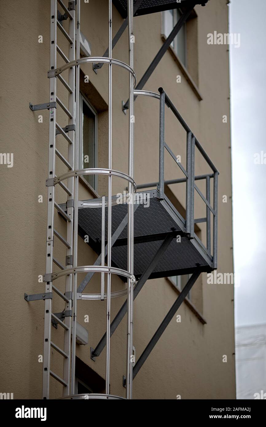 steel stairs and balconies on the outside of a house, rescue route in ...