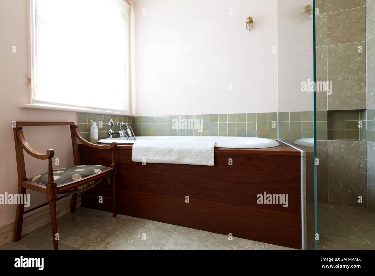 Empty Interior Of Contemporary Bathroom With Bath And Shower Stock ...