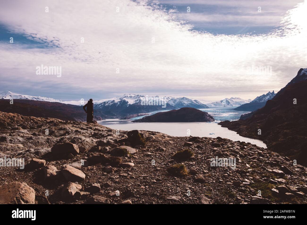 Man standing on stone rock hi-res stock photography and images - Alamy