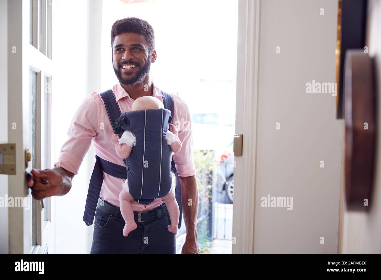 African man carrying baby in hi-res stock photography and images - Alamy