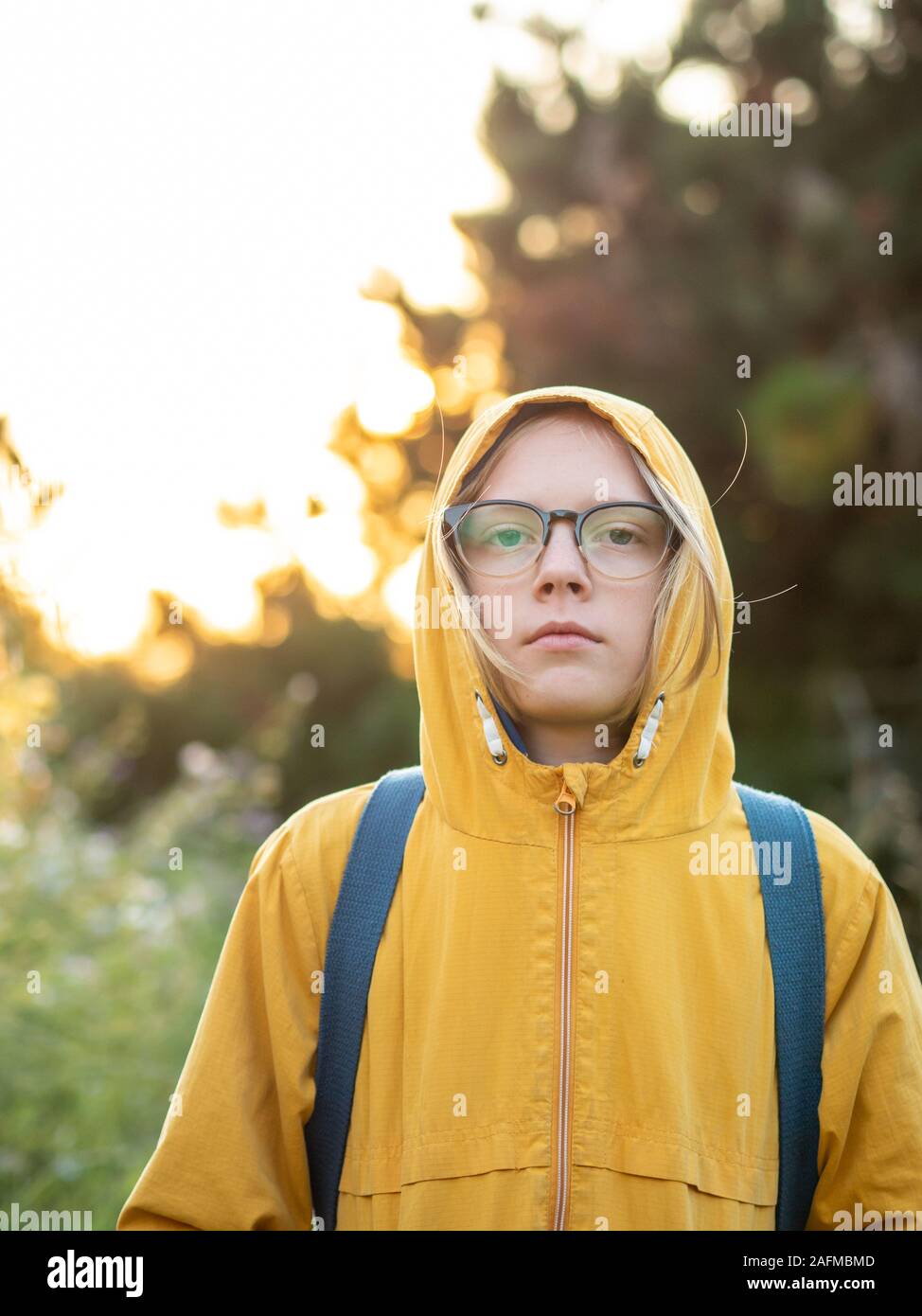 Portrait of serious tween in outdoor setting looking at camera Stock ...