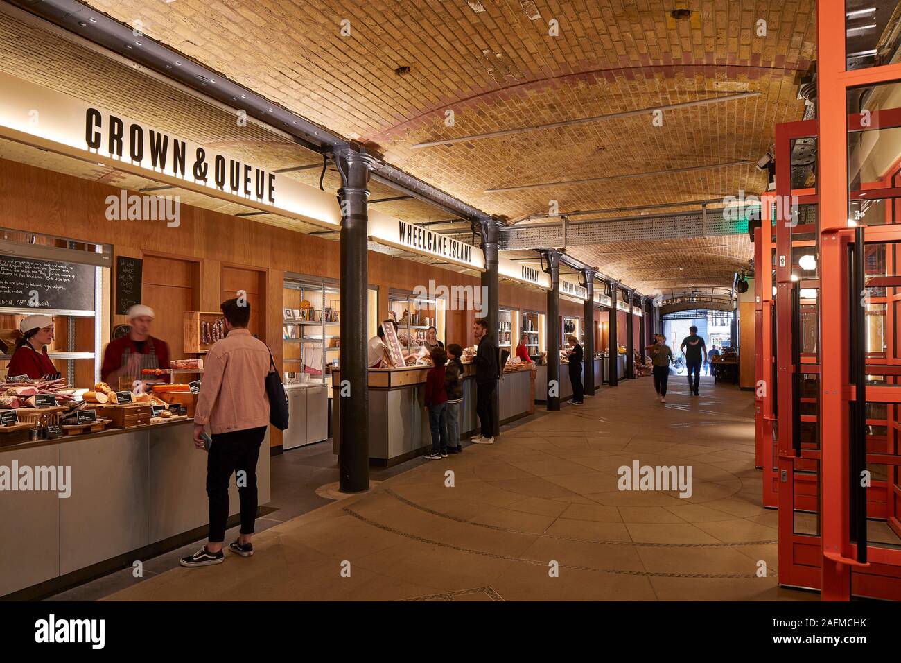 Food retail stalls on ground level. Seven Dials Market, London, United ...