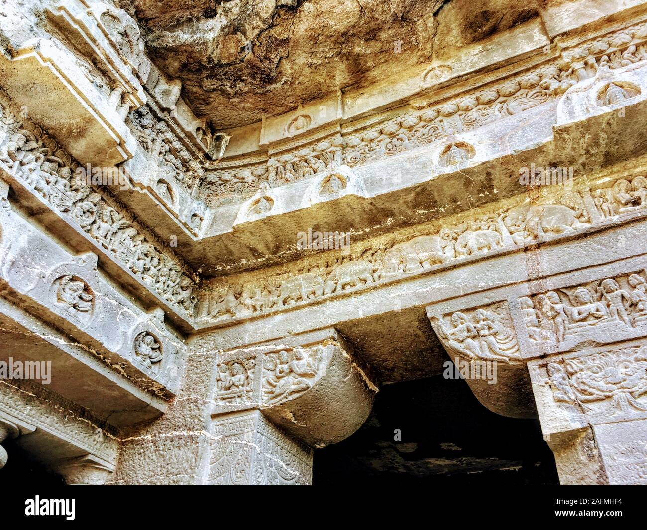 Ajanta caves with Buddha statue and beautiful architectural carvings on ...