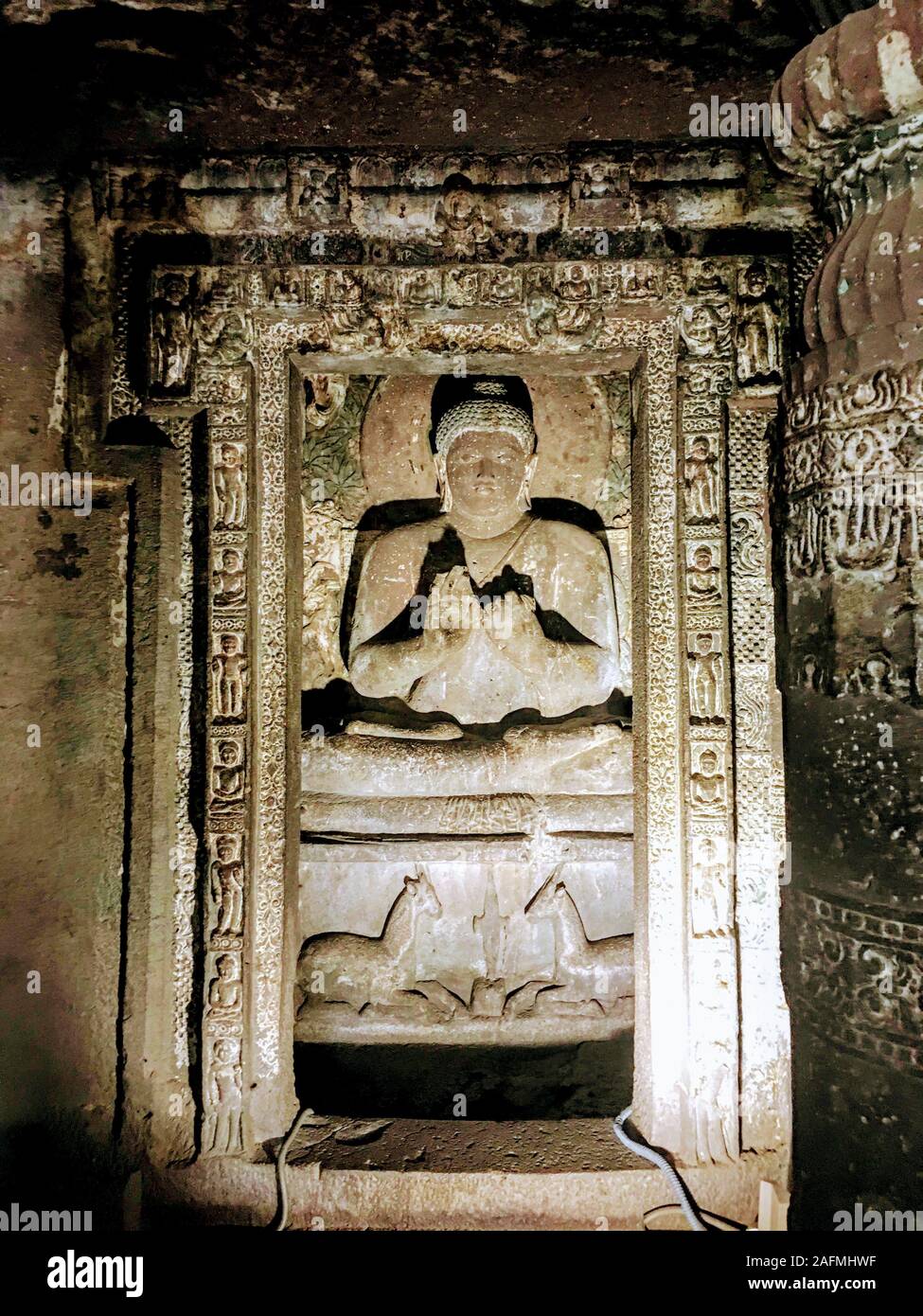 Ajanta caves with Buddha statue and beautiful architectural carvings on ...