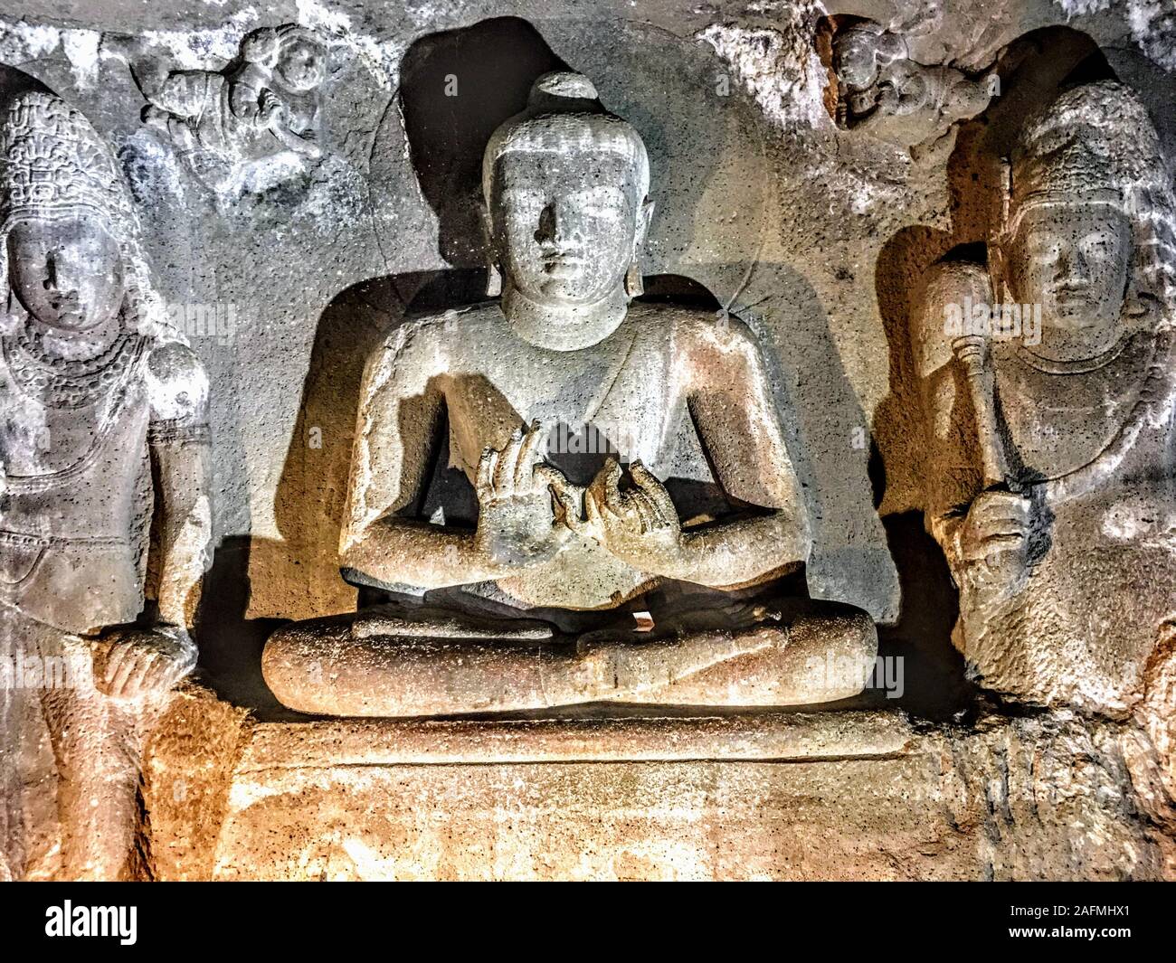 Ajanta caves with Buddha statue and beautiful architectural carvings on ...