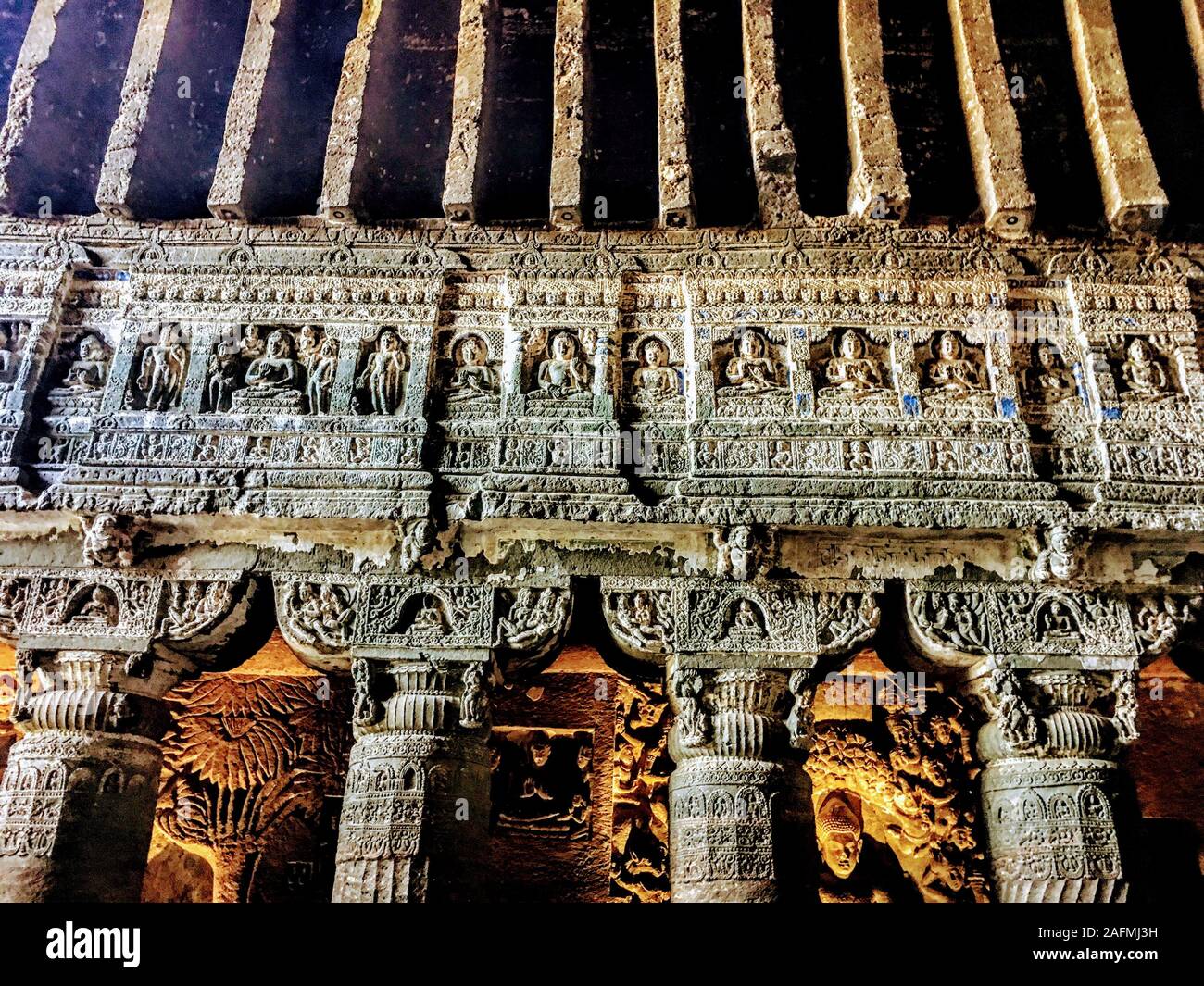 Ajanta caves with Buddha statue and beautiful architectural carvings on ...