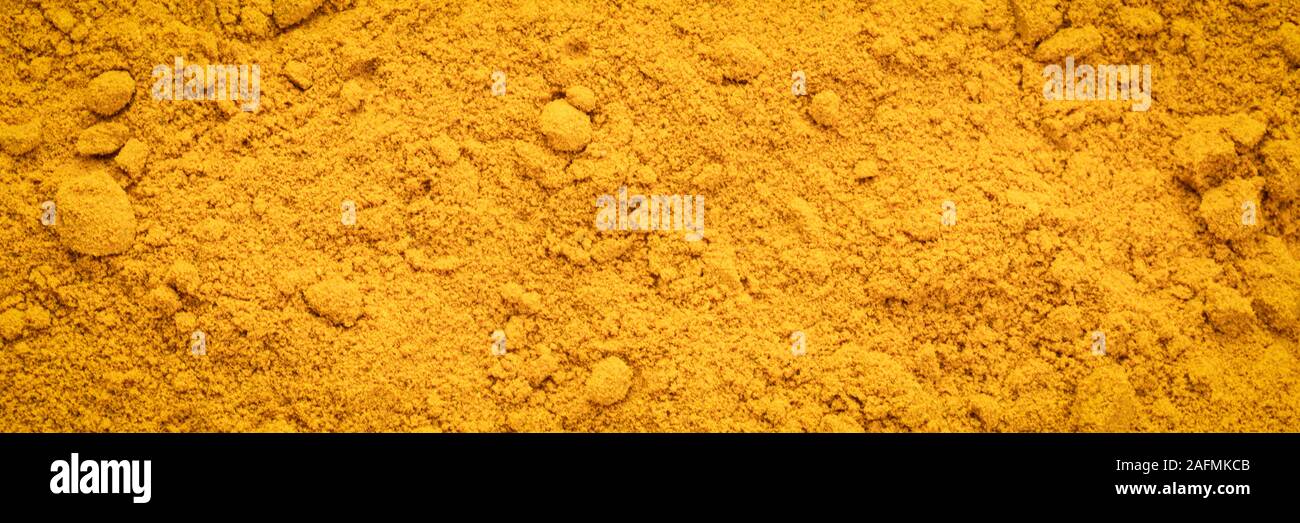 Turmeric root powder background and texture, panoramic banner Stock ...