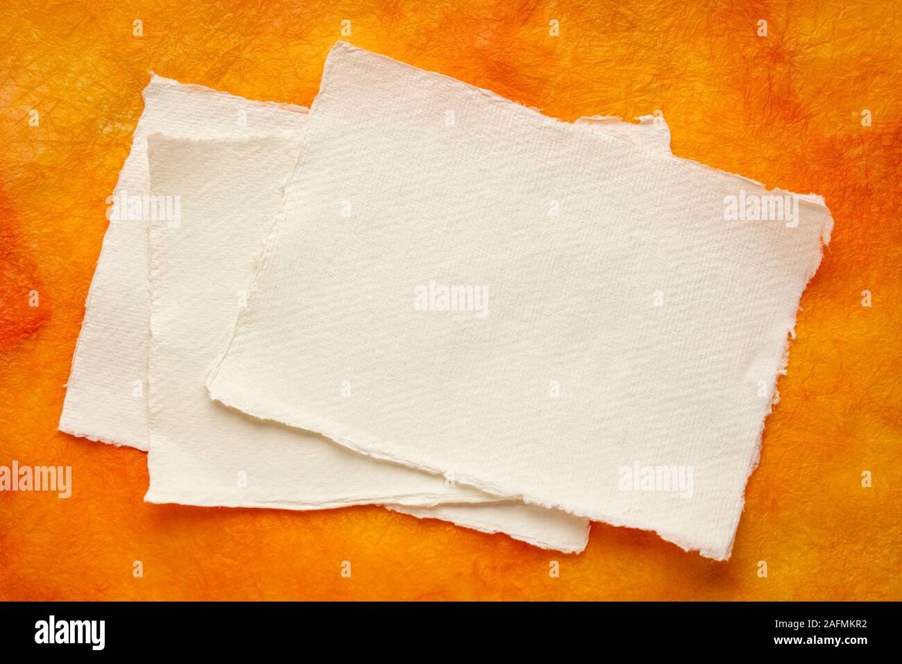 small sheets of blank white Khadi rag paper from South India against ...