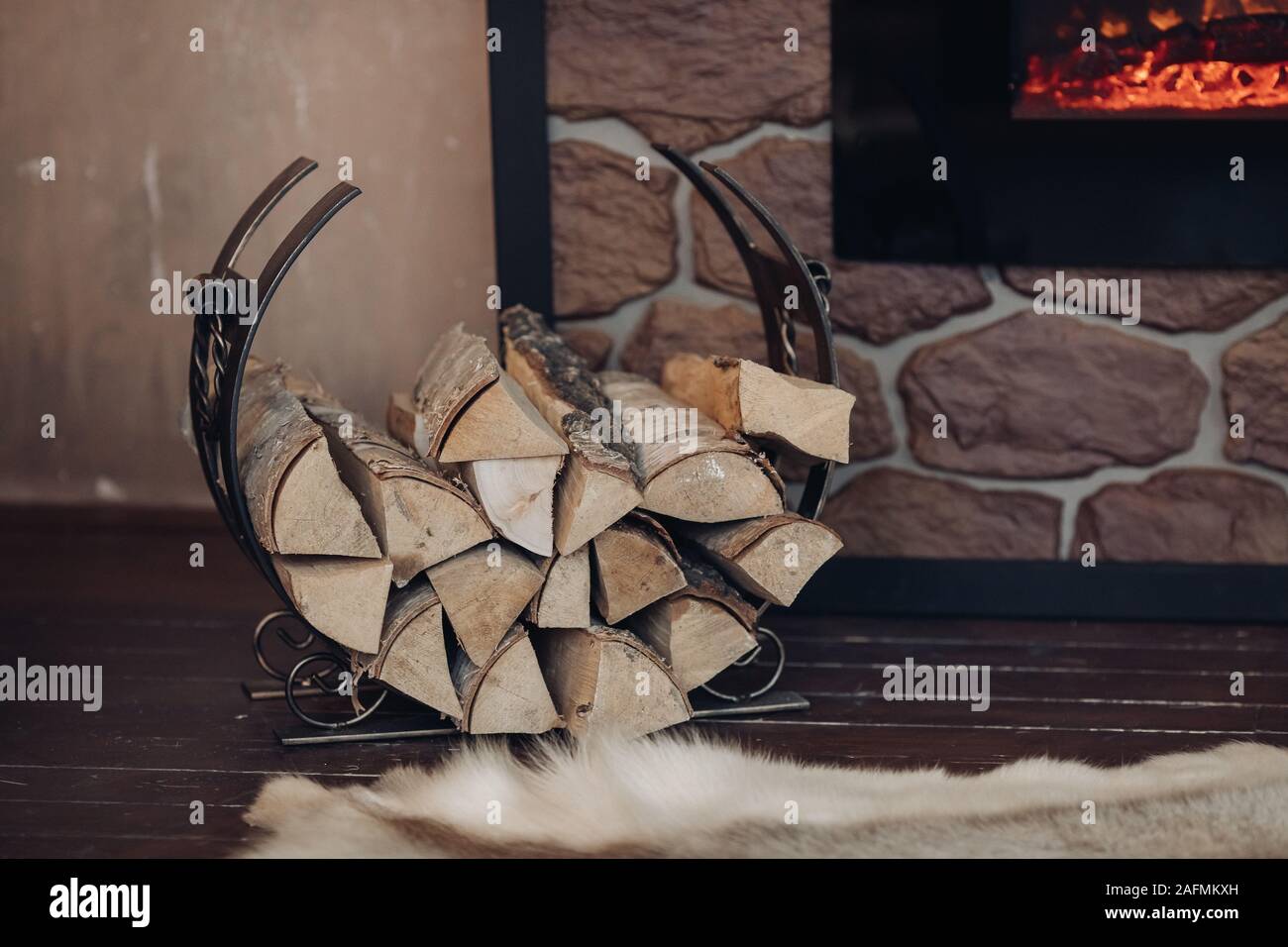 Pile of logs next to the fireplace Stock Photo - Alamy