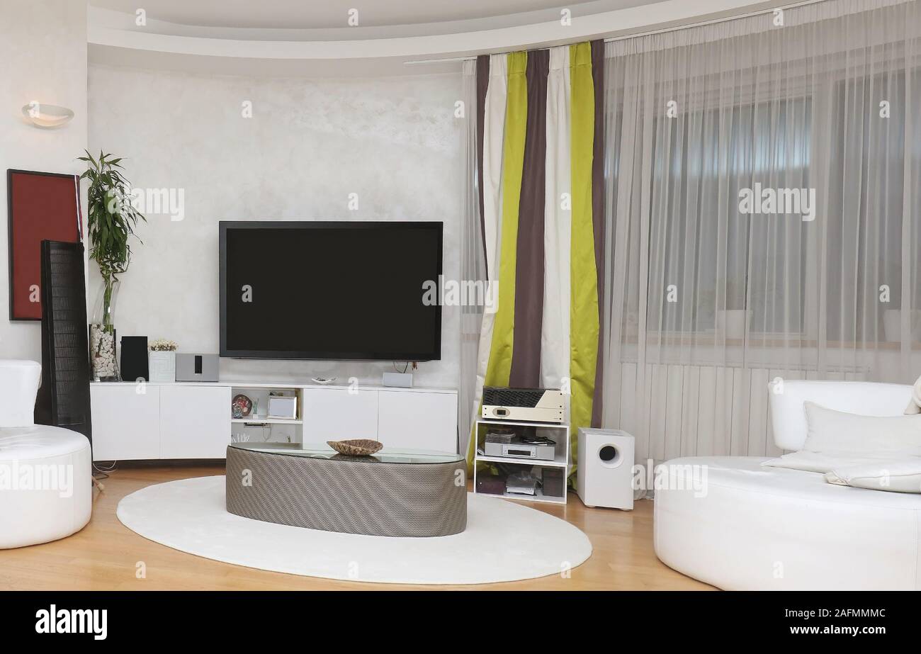 Modern apartment living room interior with large television screen ...