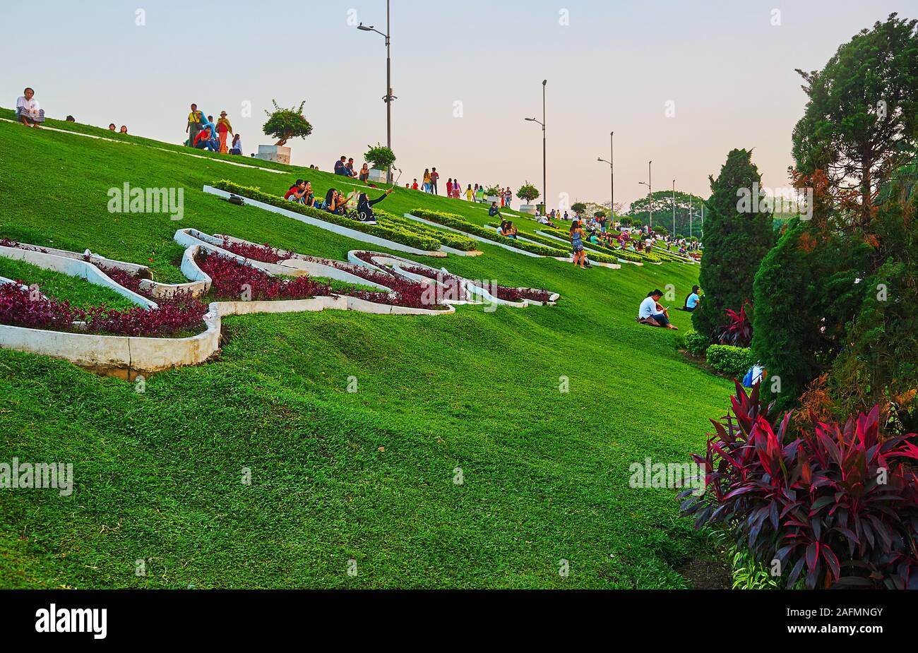 YANGON, MYANMAR - MARCH 2, 2018: The evening park of Inya lake in ...