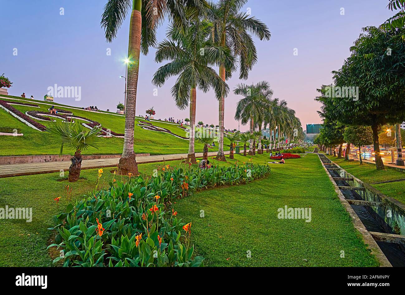 Enjoy the cool air and beautiful landscaping of evening Inya lake park ...