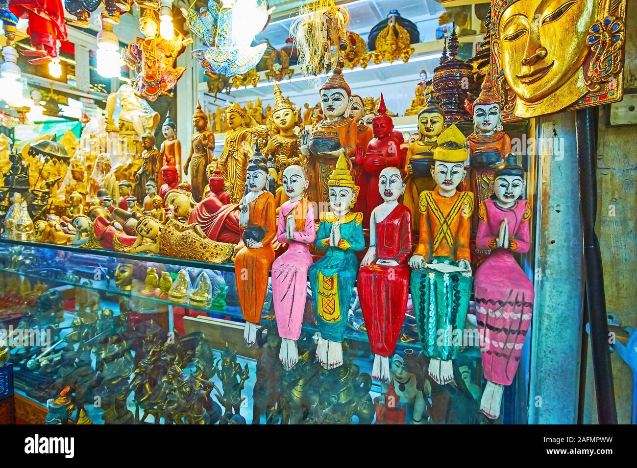 The showcase of the stall in Bogyoke Aung San Market is full of antique ...