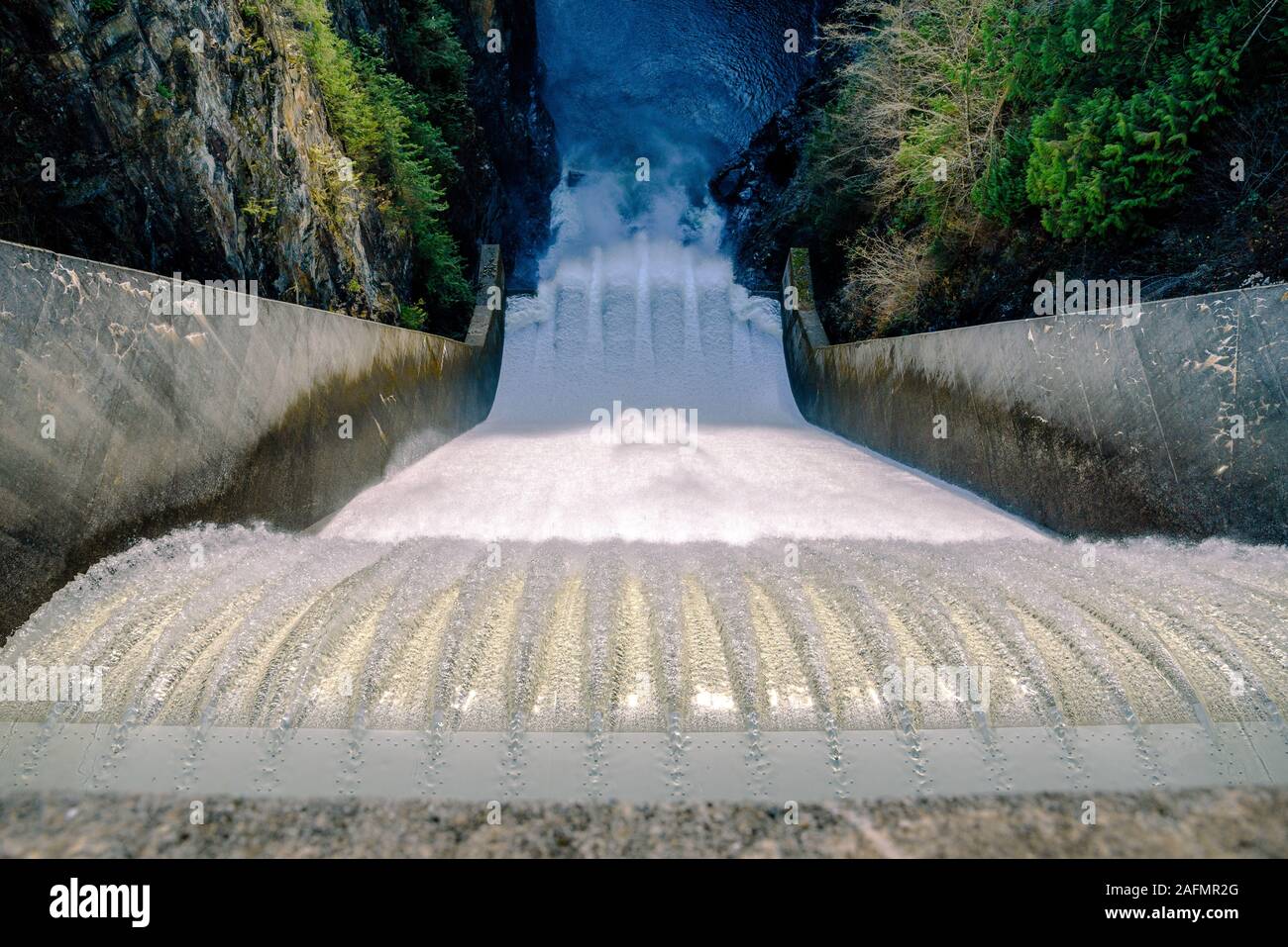 An overhead view of the Capilano River flowing down the spillway of the ...