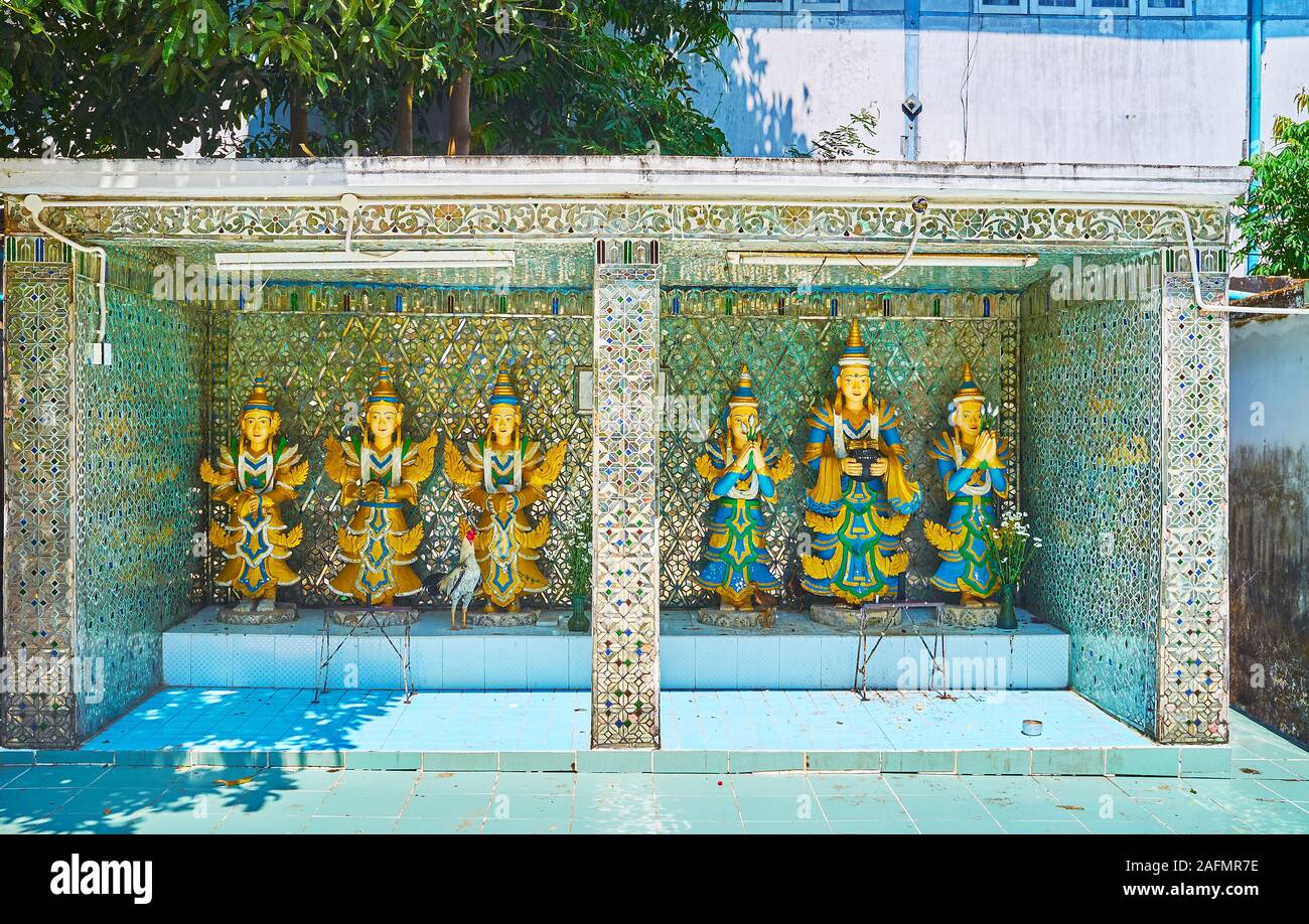 The small Nat (spirit deities) shrine with small statues and fine ...